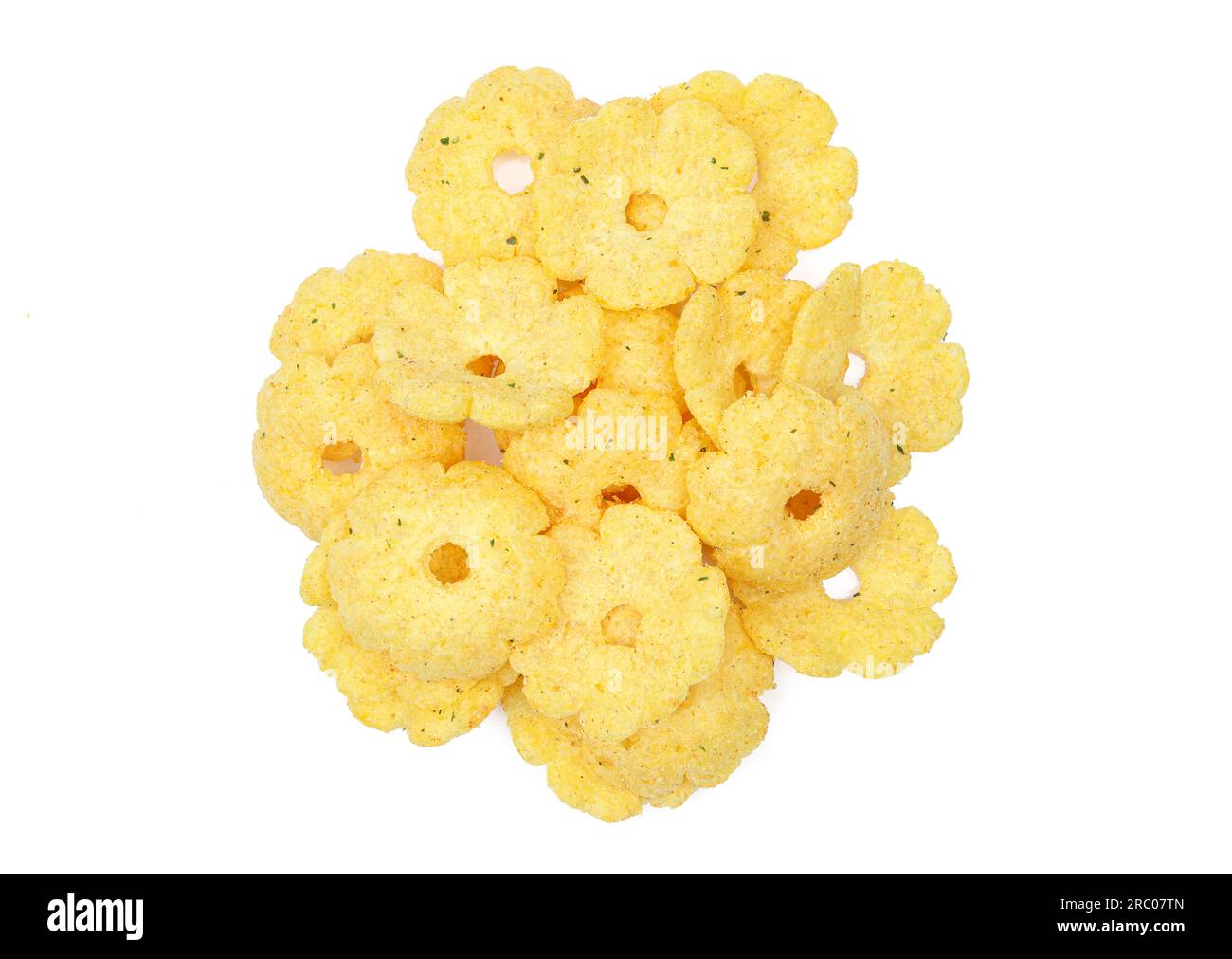 Pile of flower blossom shaped salty puffy cheesy snack crisps isolated ...