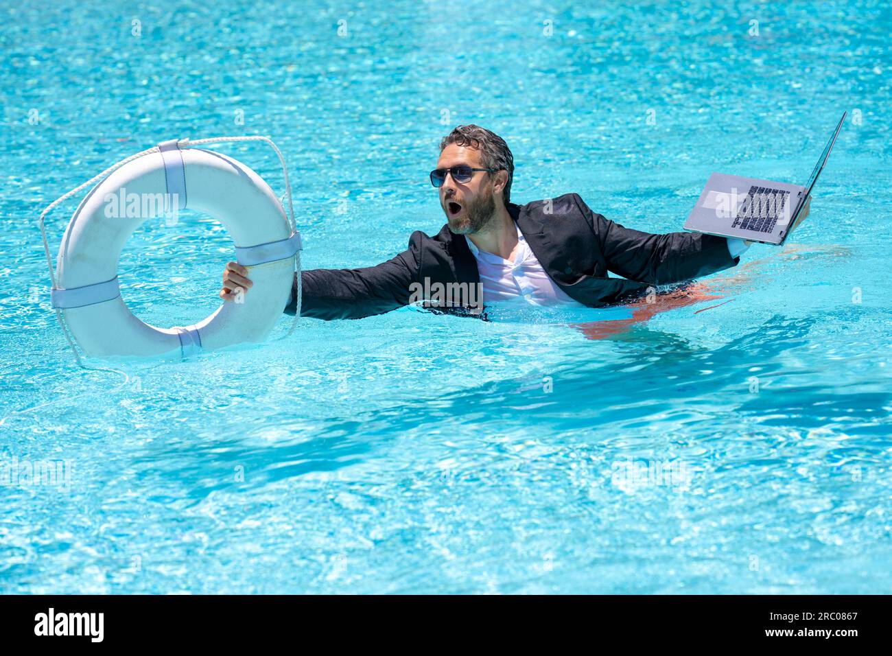 Helping business. Business man in suit hold laptop and help lifebuoy in ...