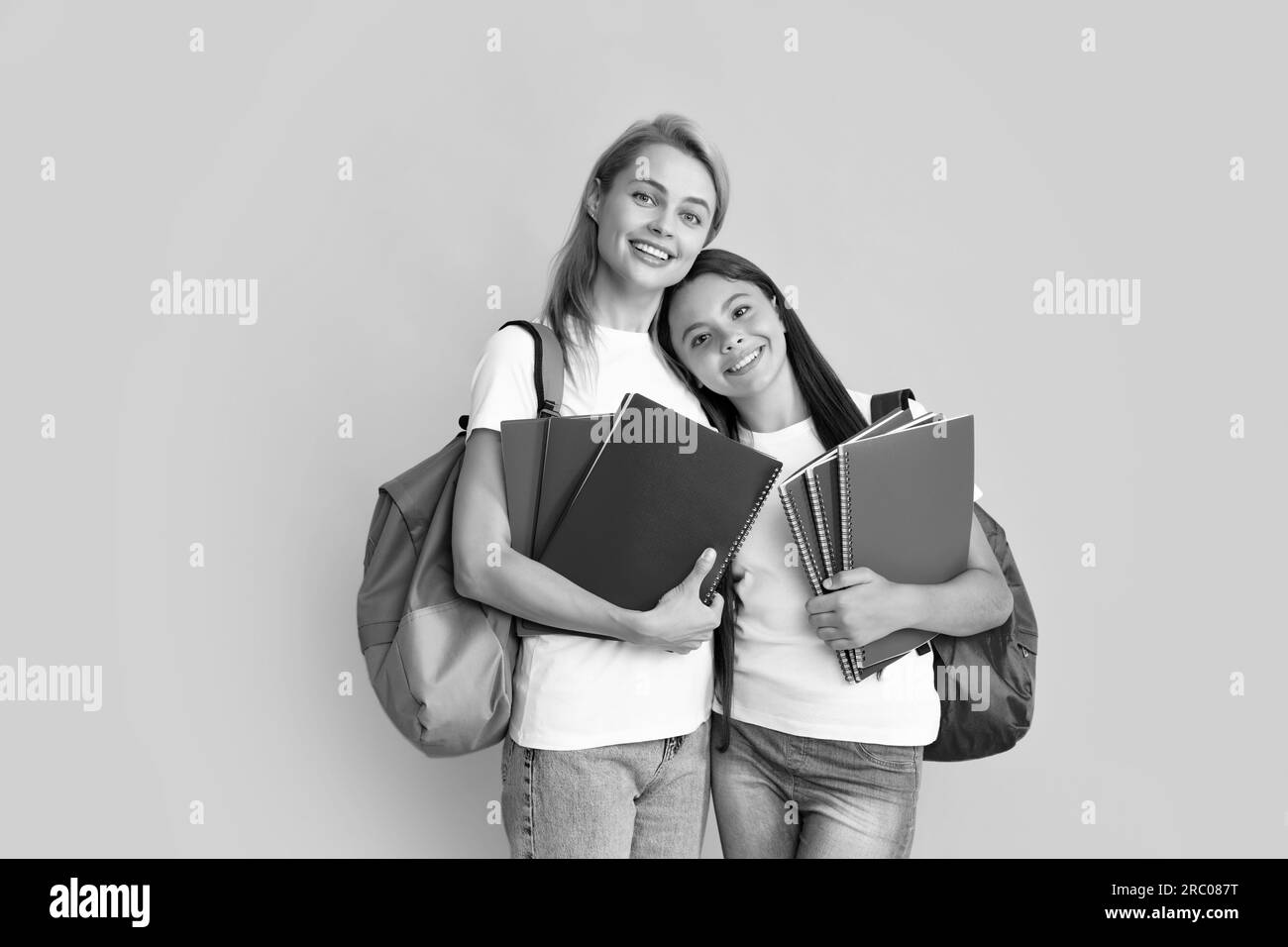 School, learning and education concept. Mother and daughter schoolgirls ...