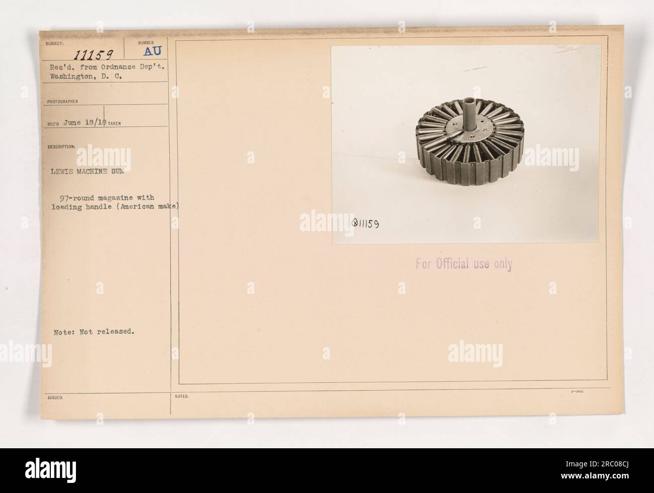 A Lewis Machine Gun with a 97-round magazine and loading handle, made ...