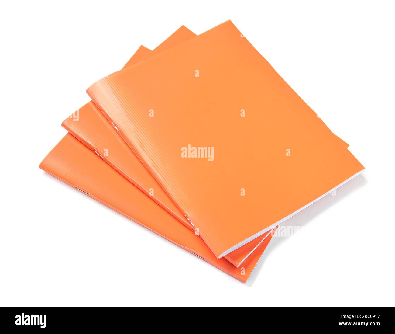 Orange notebooks isolated on white background Stock Photo - Alamy