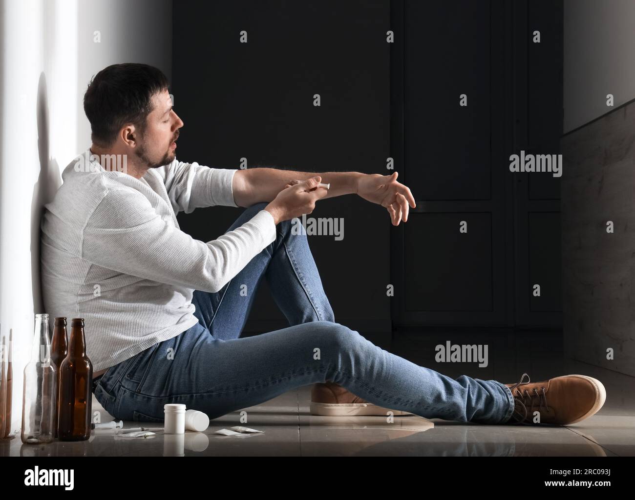 Male drug addict making injection in hall Stock Photo - Alamy