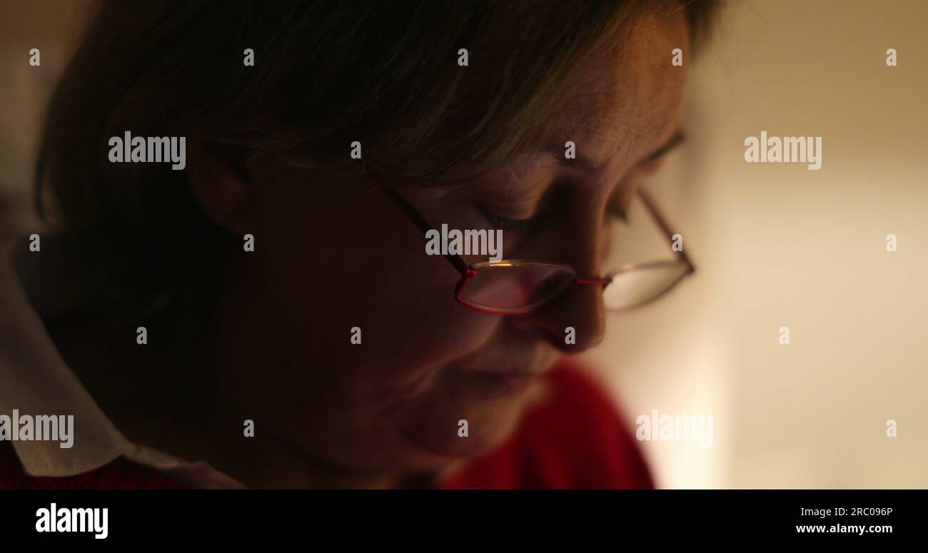 Older person using technology night hi-res stock photography and images ...