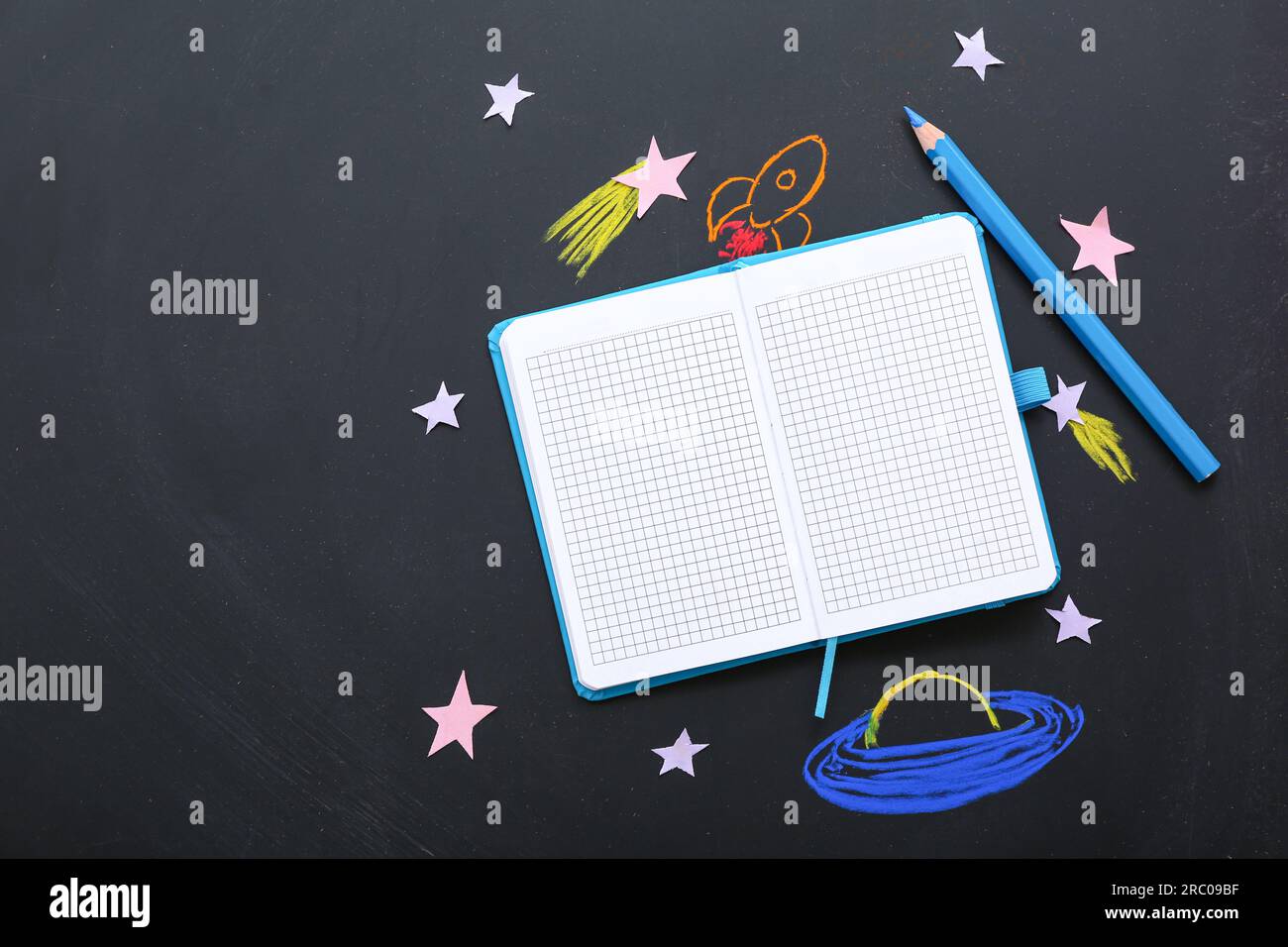 Creative composition with blank notebook, drawings and different ...