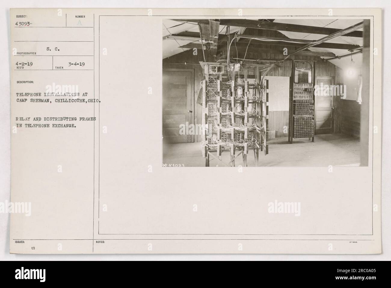Photo shows a technician working on relay and distributing frames in ...
