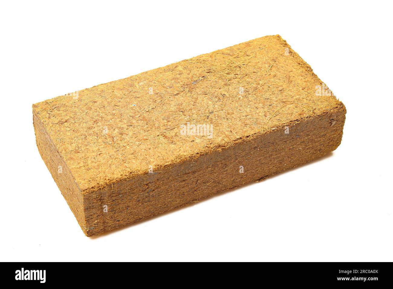 Dry coco fiber compressed brick isolated on white background. Organic ...