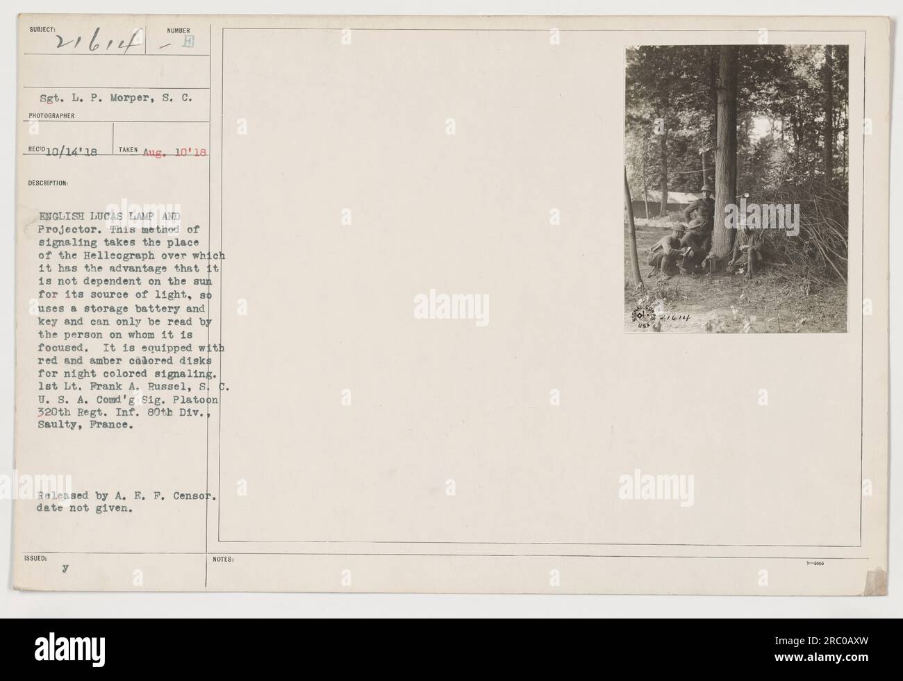 Sgt. L.P. Morper of the Signal Corps using an English Lucas Lamp and ...