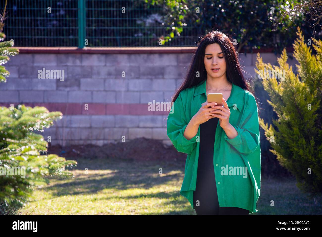 Positive woman texting online using hi-res stock photography and images ...