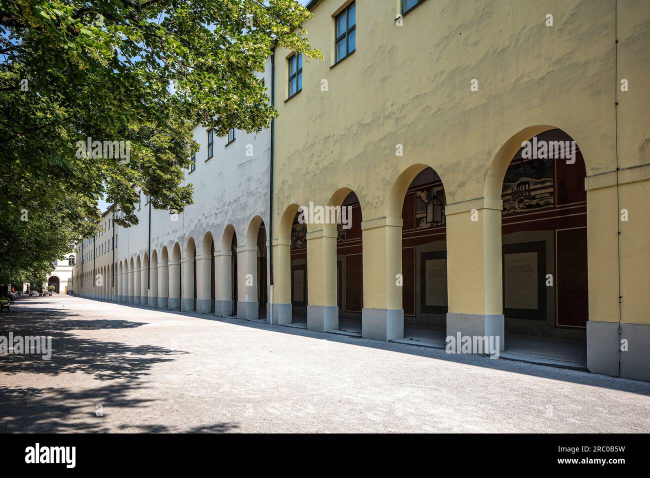 Promenade with long arcade columns surrounding Hofgarten Park in Munich ...