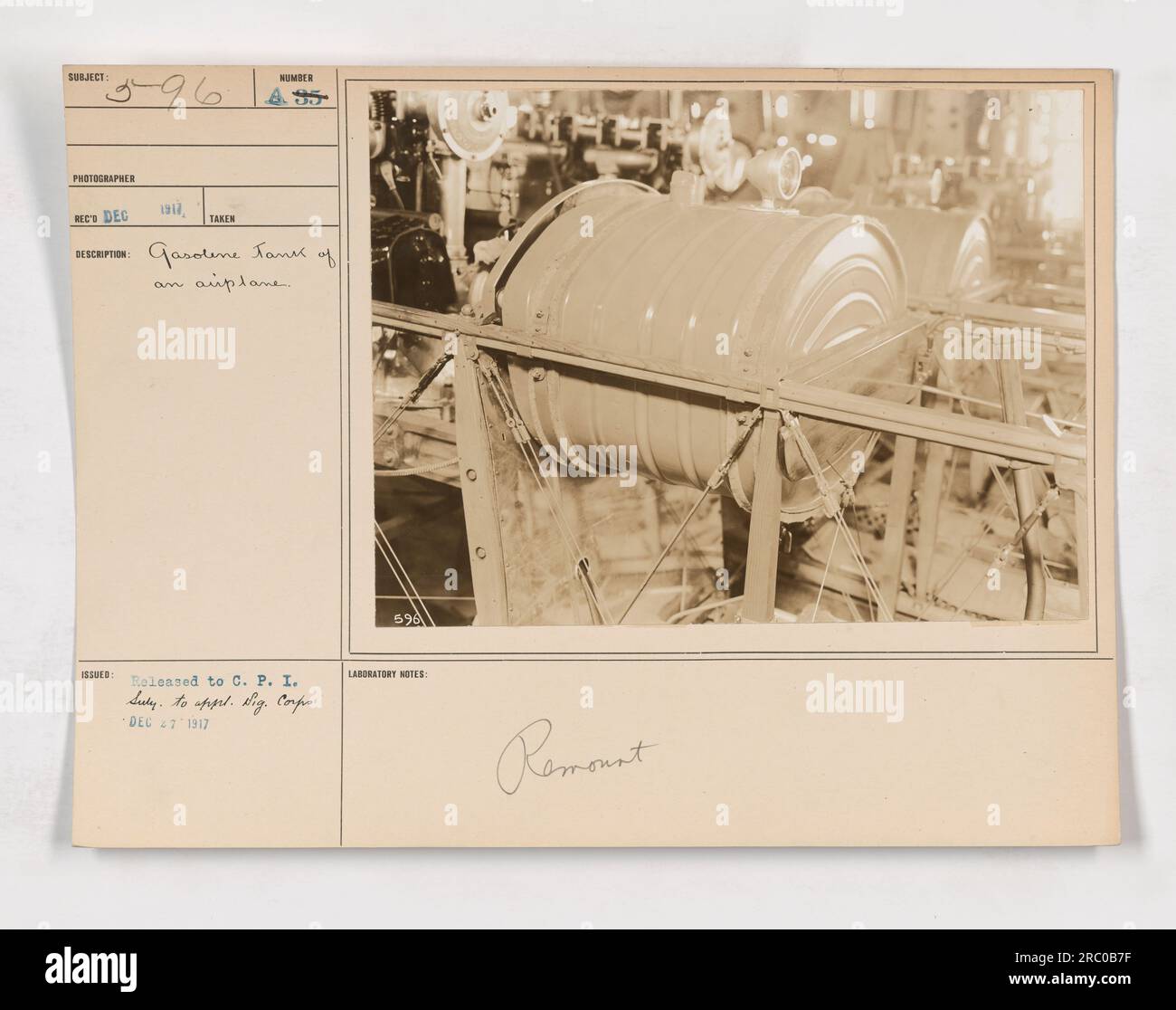 A photograph of gasoline tanks being produced for airplanes during ...