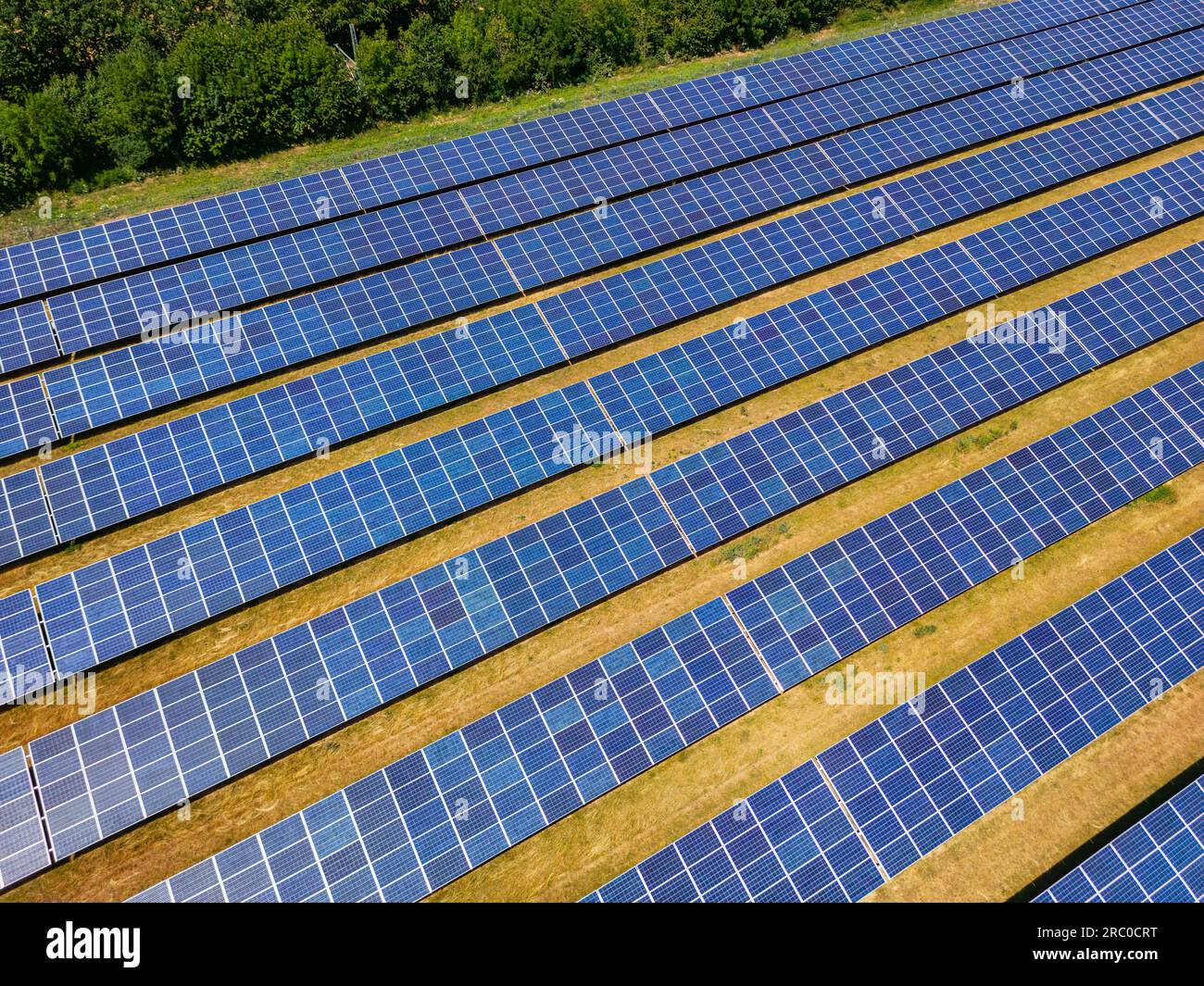 Solar power plant with rows of photovoltaic panels on an agricultural ...