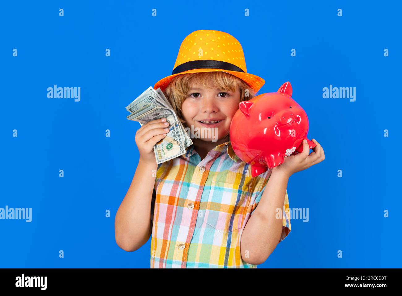 Happy rich kid boy with money dollars cash. Business, saving and ...