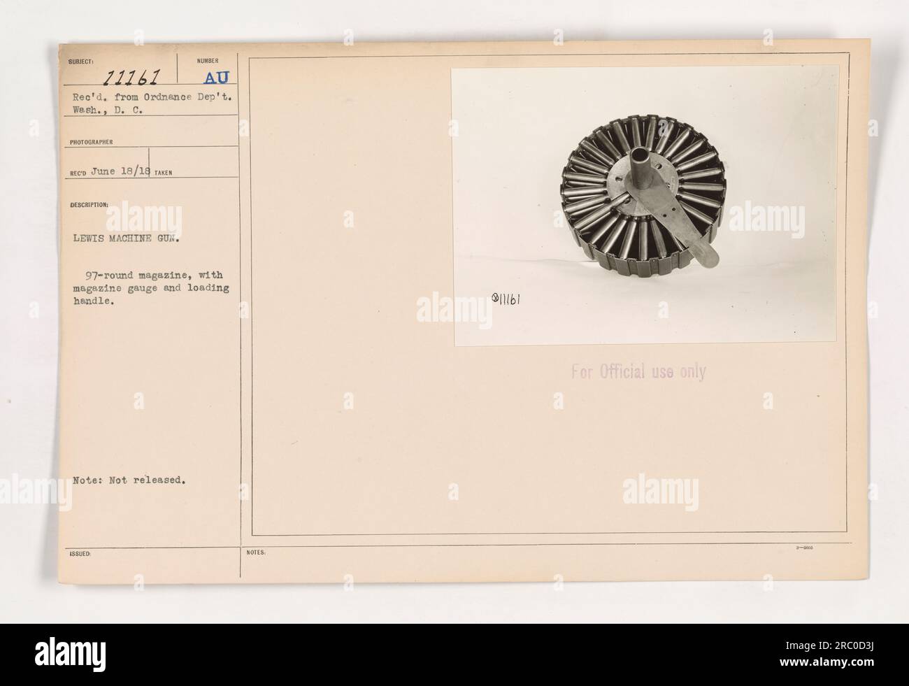 A Lewis machine gun with a 97-round magazine, magazine gauge, and ...