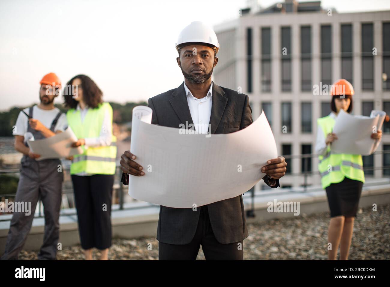 Portrait of african american investor dressed in business attire posing ...