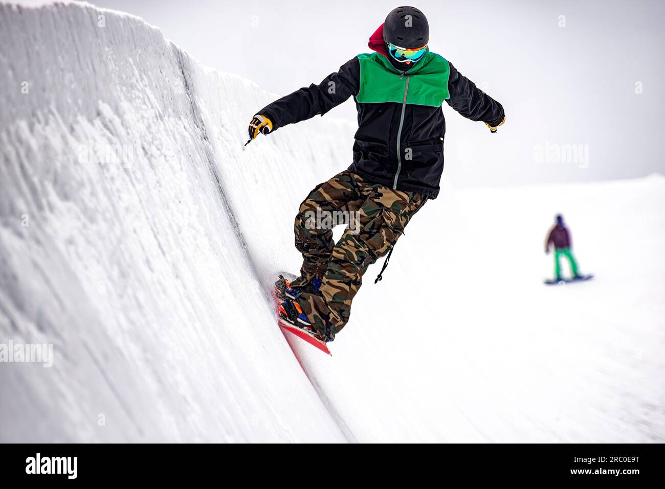 Snowboarder on an half-pipe slope Stock Photo - Alamy