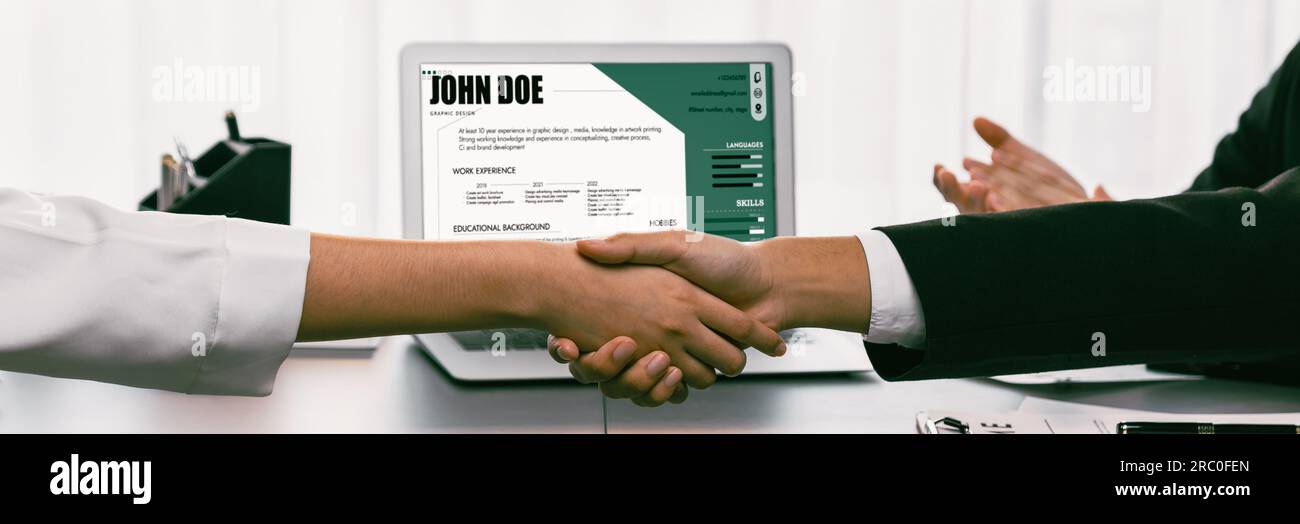 Interviewer handshaking the applicant hi-res stock photography and ...