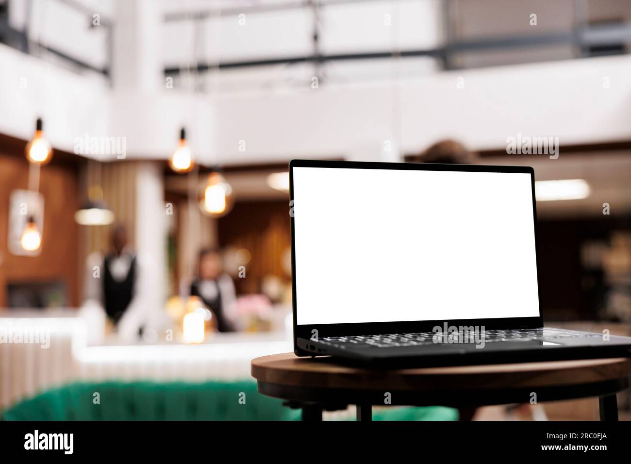 Laptop show isolated white display in lounge area at hotel reception ...