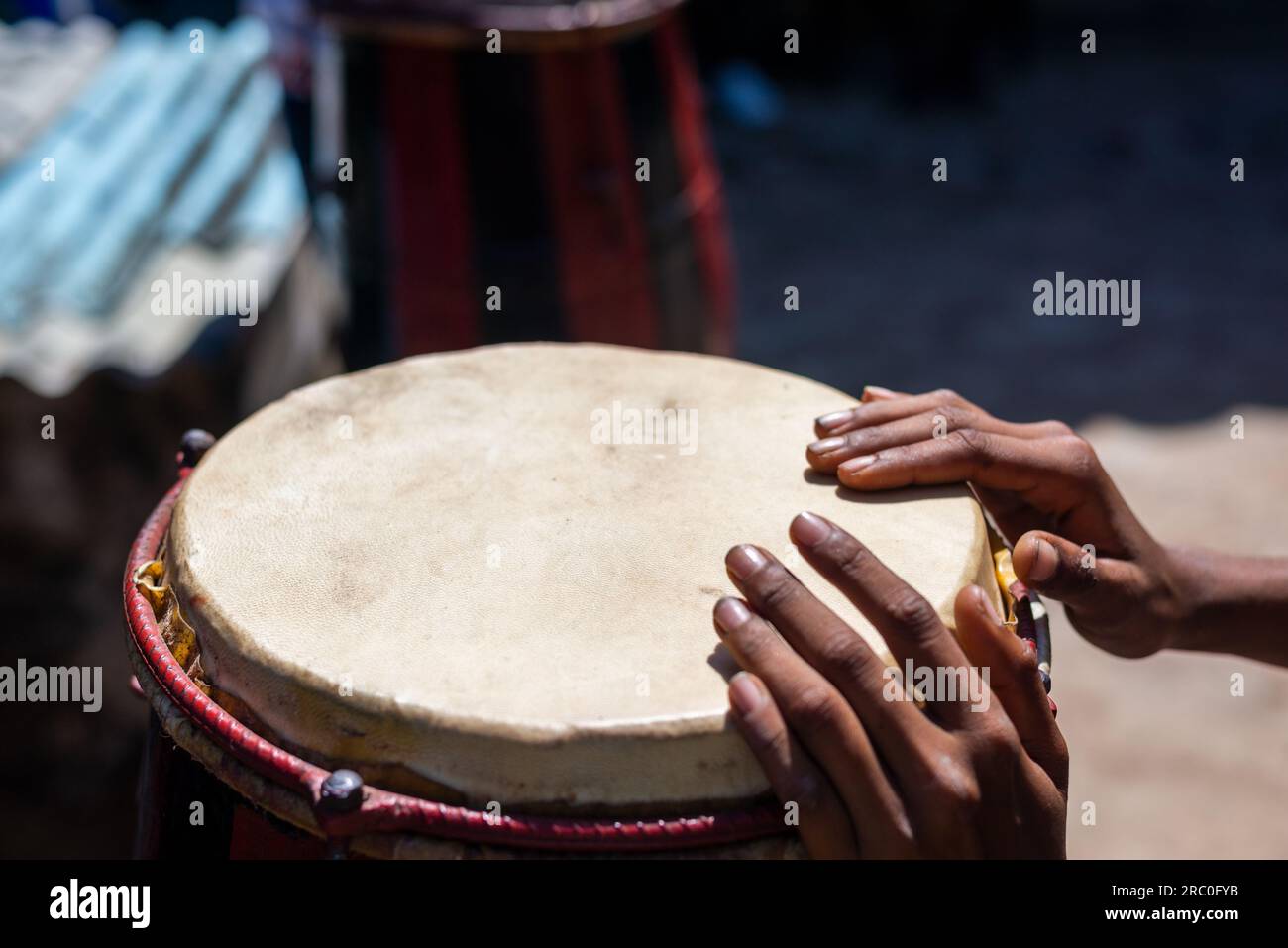Hands of a musician standing still on a Brazilian atabaque. Acupe ...