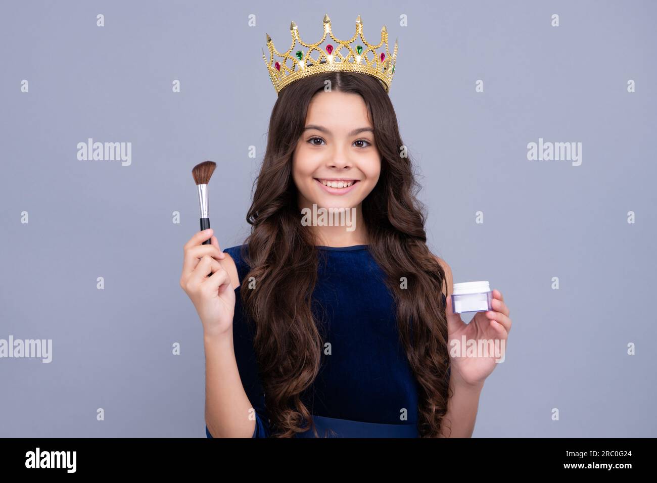 Kids make up products. Makeup teen child artist apply face powder with ...