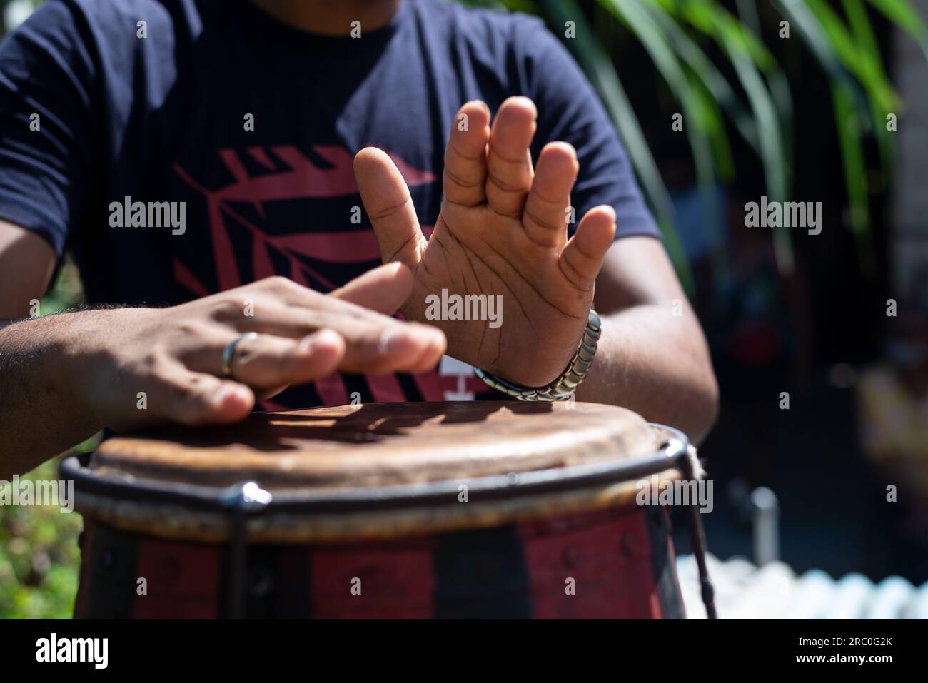 Hands of a musician playing the atabaque. Constant and perfect rhythm ...