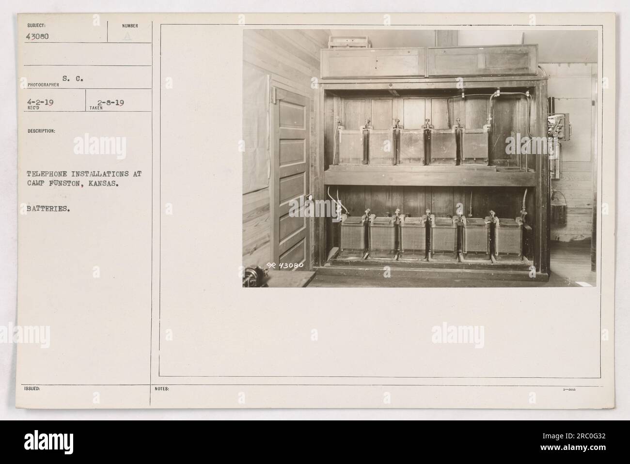 Soldiers working on telephone installations at Camp Funston, Kansas ...