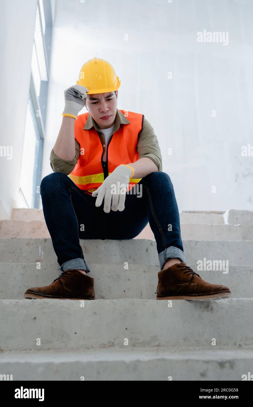 Engineers or architects show signs of exhaustion and discouragement ...