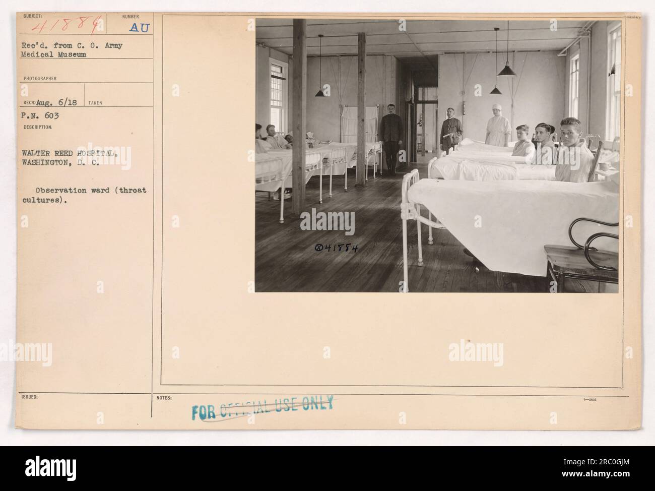 Soldiers being examined for throat cultures in the observation ward of ...