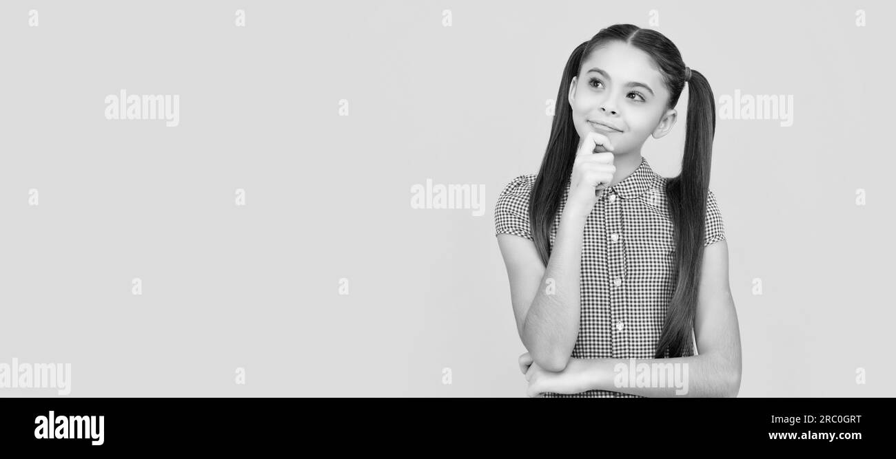 Start thinking big. Thoughtful girl yellow background. School age child ...