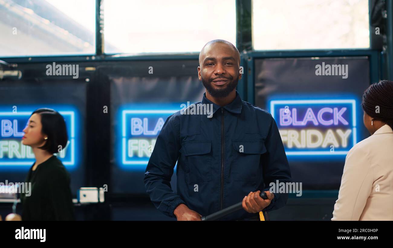 Patrol agent in shopping center with uniform and equipment, working to ...