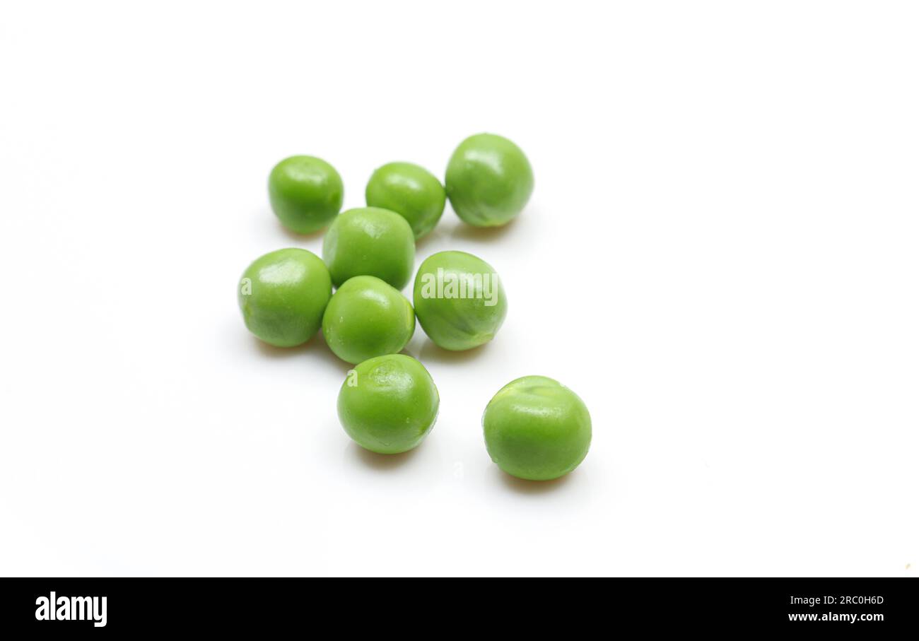 Group of fresh green peas isolated on white background Stock Photo - Alamy