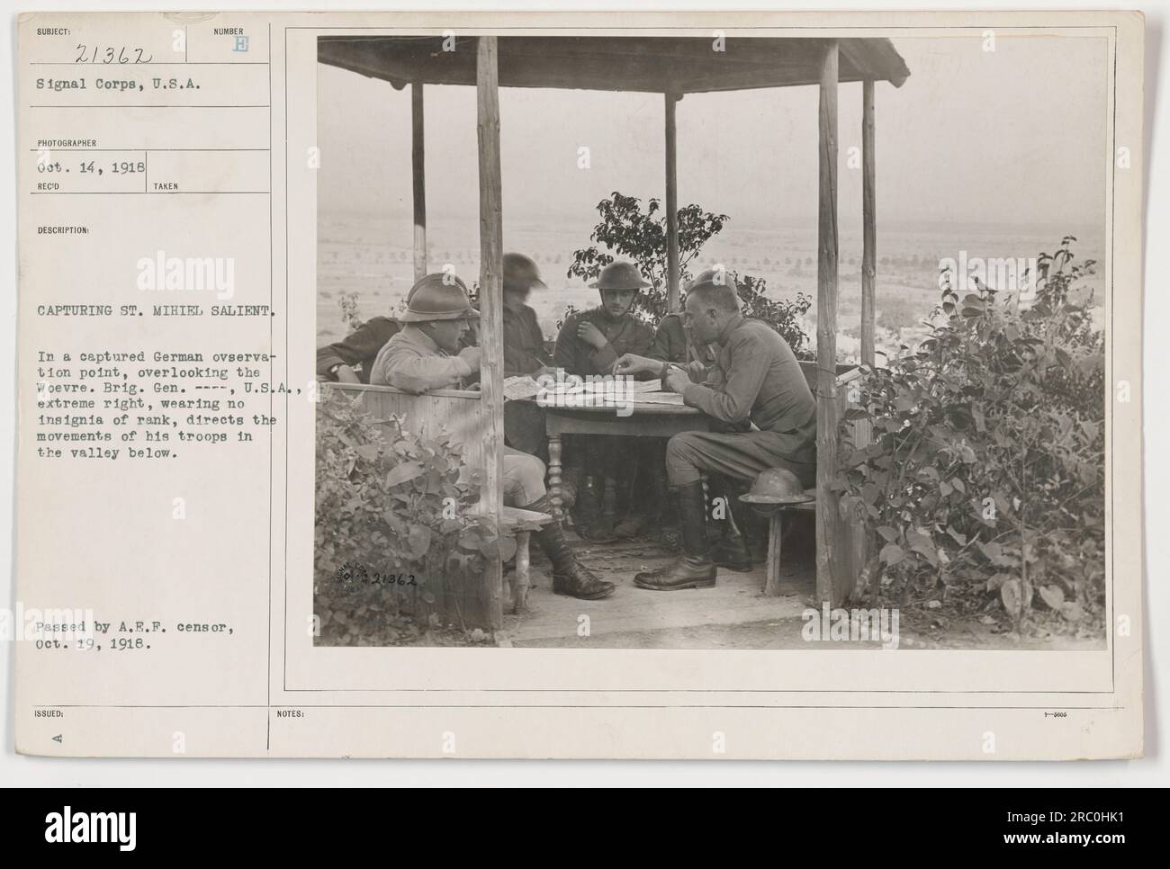 Brig. Gen., U.S.A., directs troops in the valley below from a captured ...