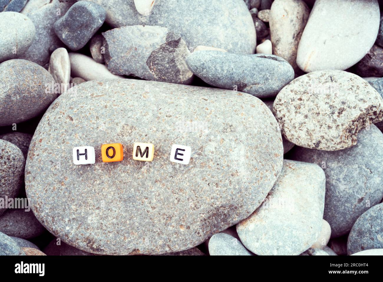 home word on pebble stone for background and inspiration or multiple ...