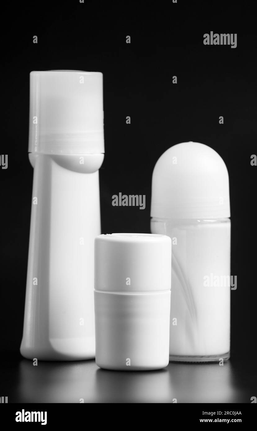 Set of white antiperspirant deodorant roll-on, isolated on black ...