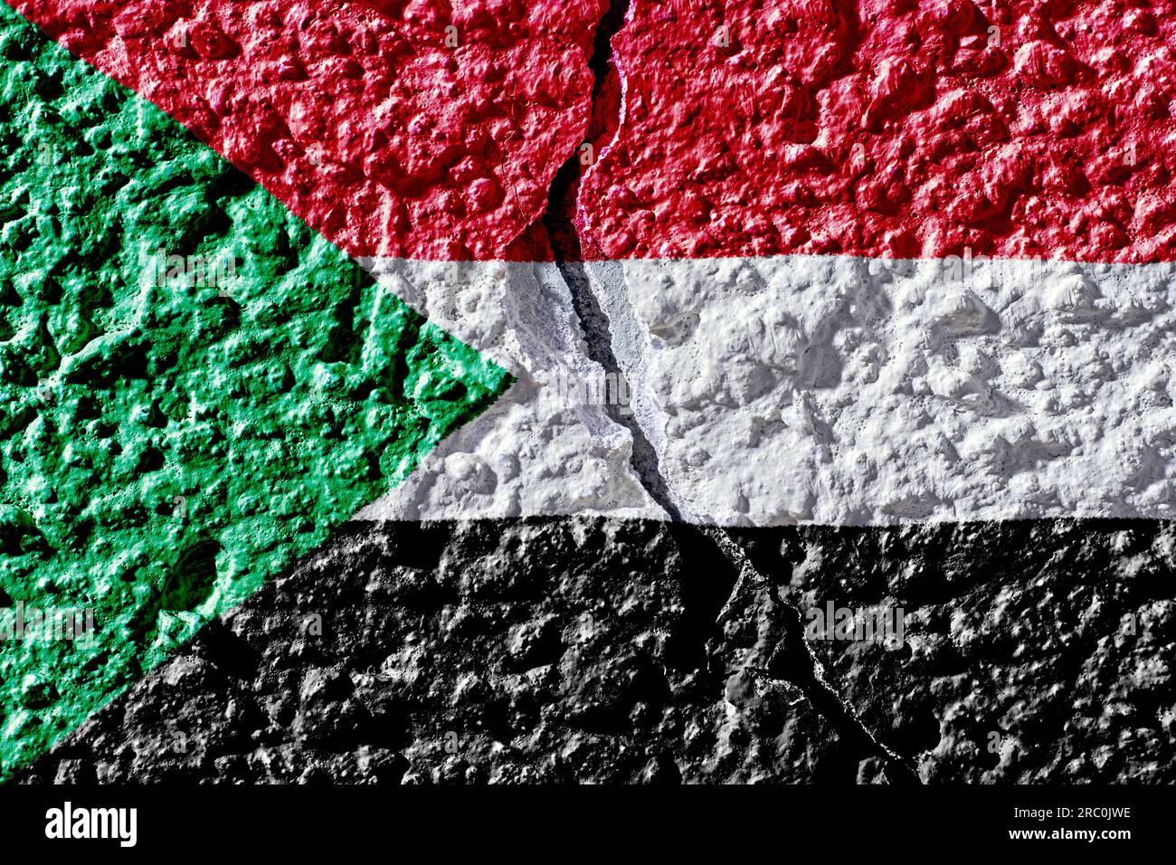 Flag of Sudan on the background of a plastered wall with a crack ...