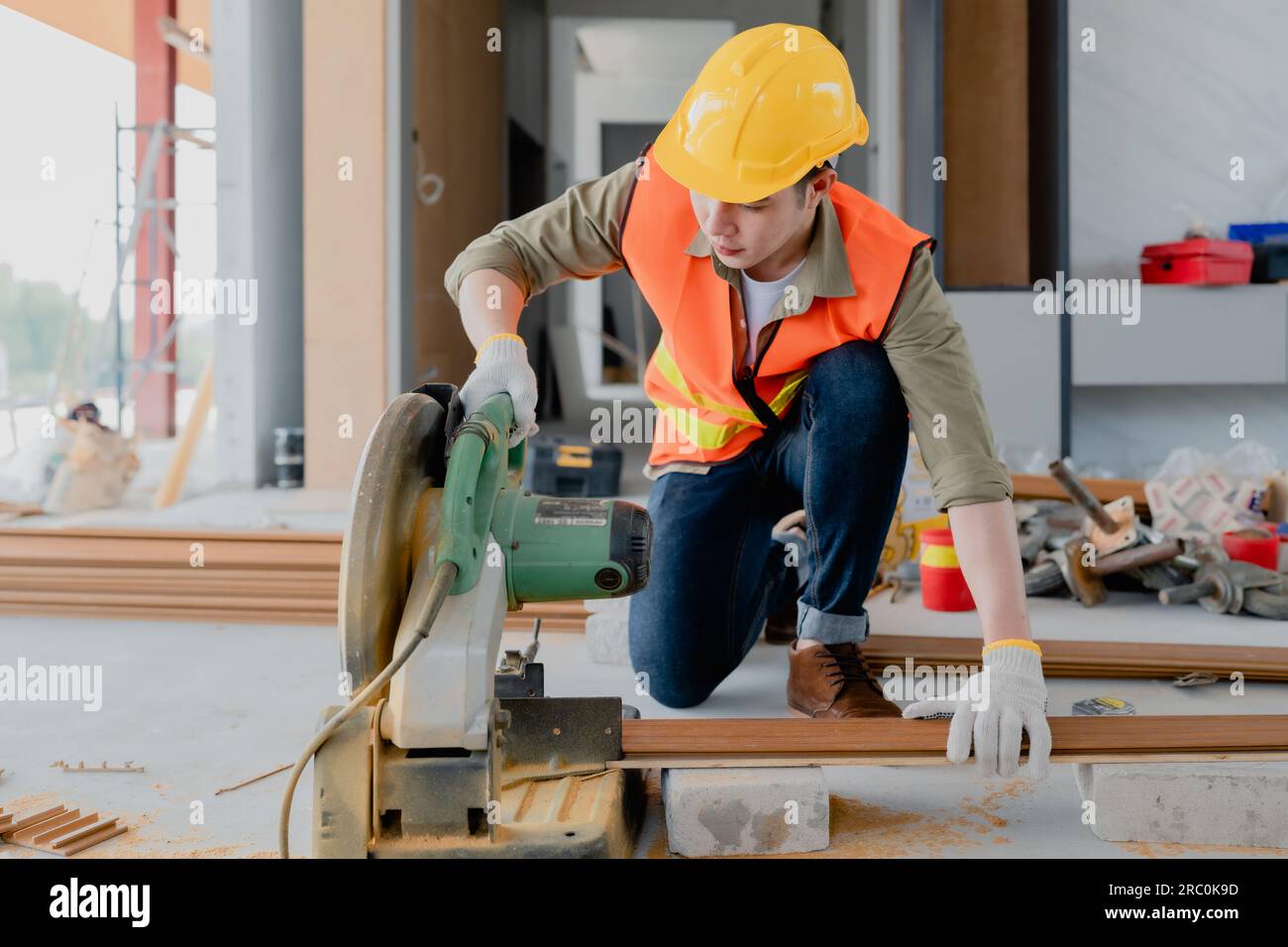 Structural worker dressed in safety gear and hard hat doing ...