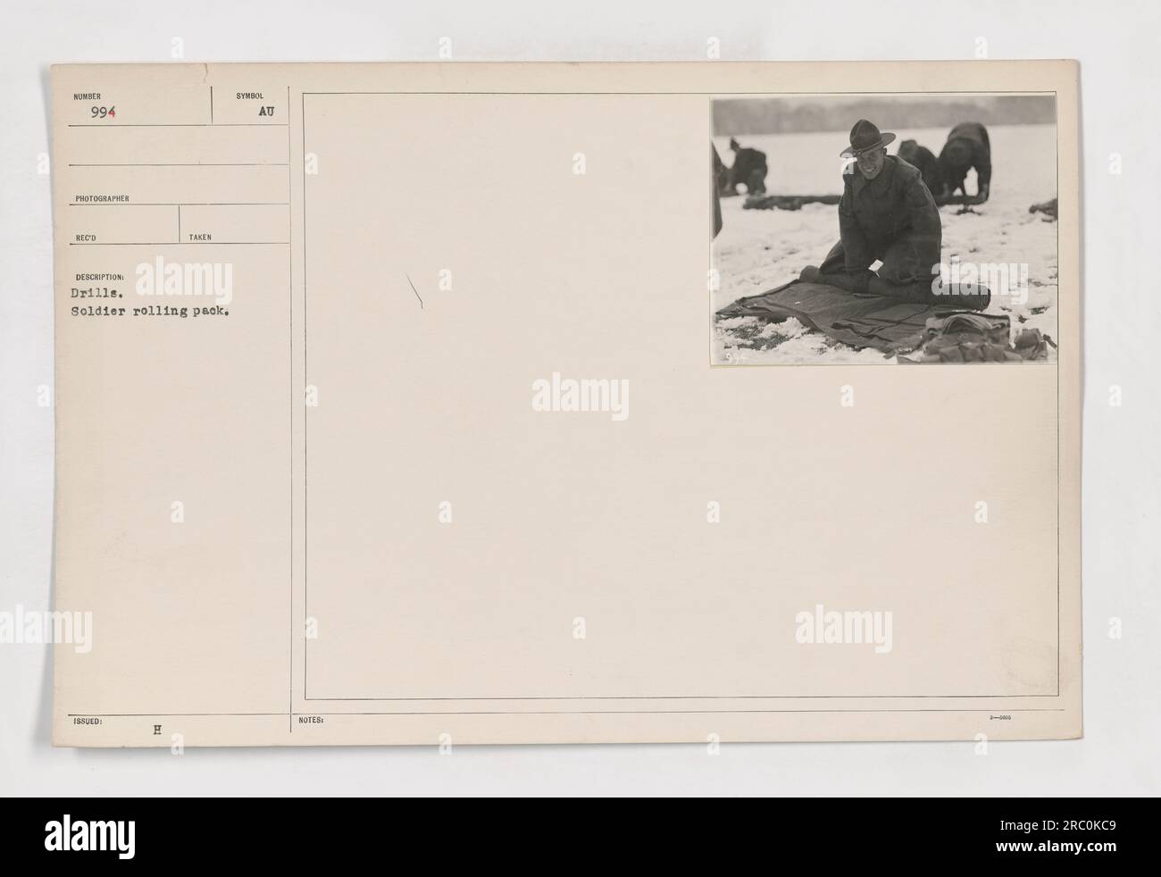 Soldiers during drills rolling their packs. This photo, numbered 994 ...