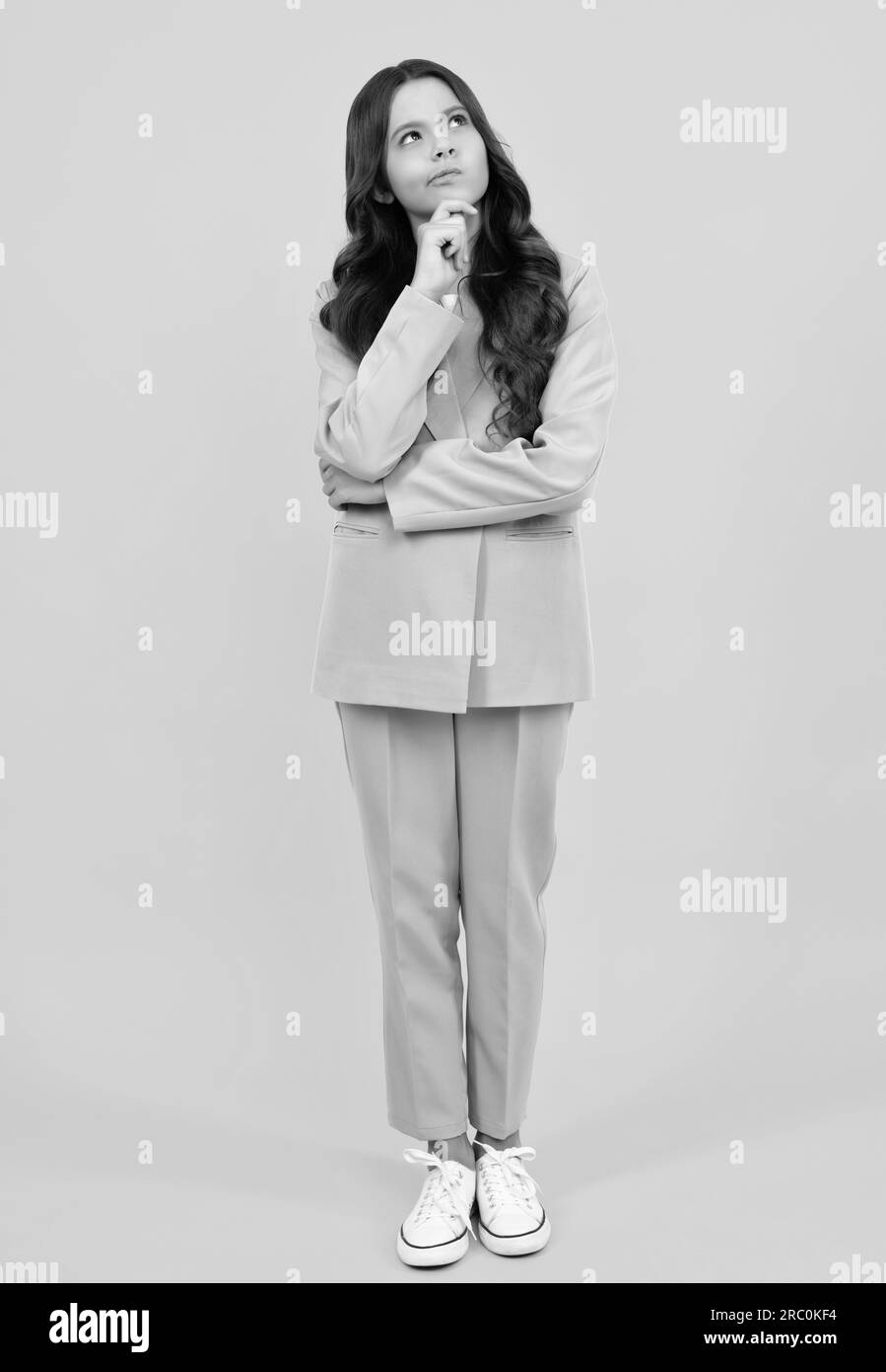 Doubtful thoughtful teenager child girl dreaming, imagining something ...