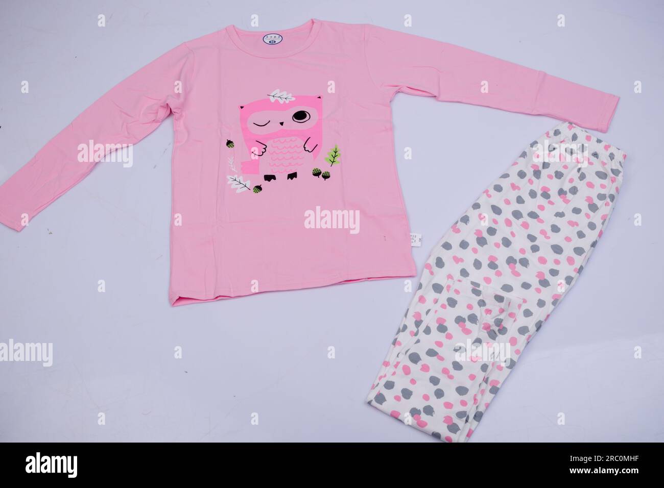 Clothe cloth small kids children outfits display Stock Photo - Alamy