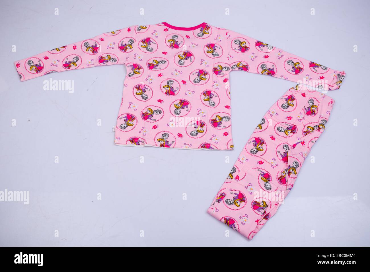 Clothe cloth small kids children outfits display Stock Photo - Alamy