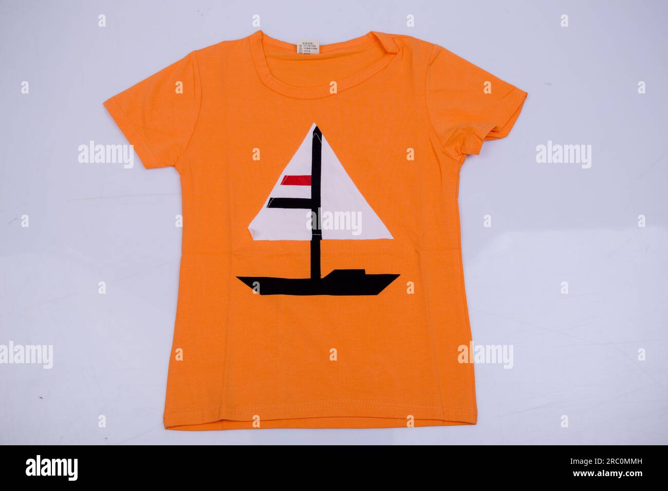 Clothe cloth small kids children outfits display Stock Photo - Alamy