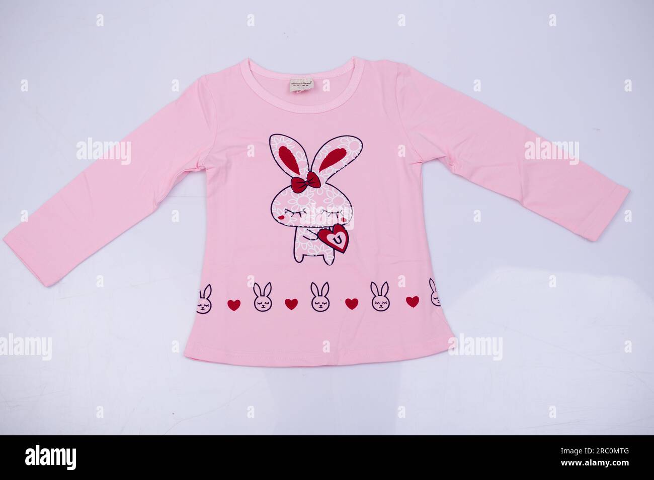 Clothe cloth small kids children outfits display Stock Photo - Alamy