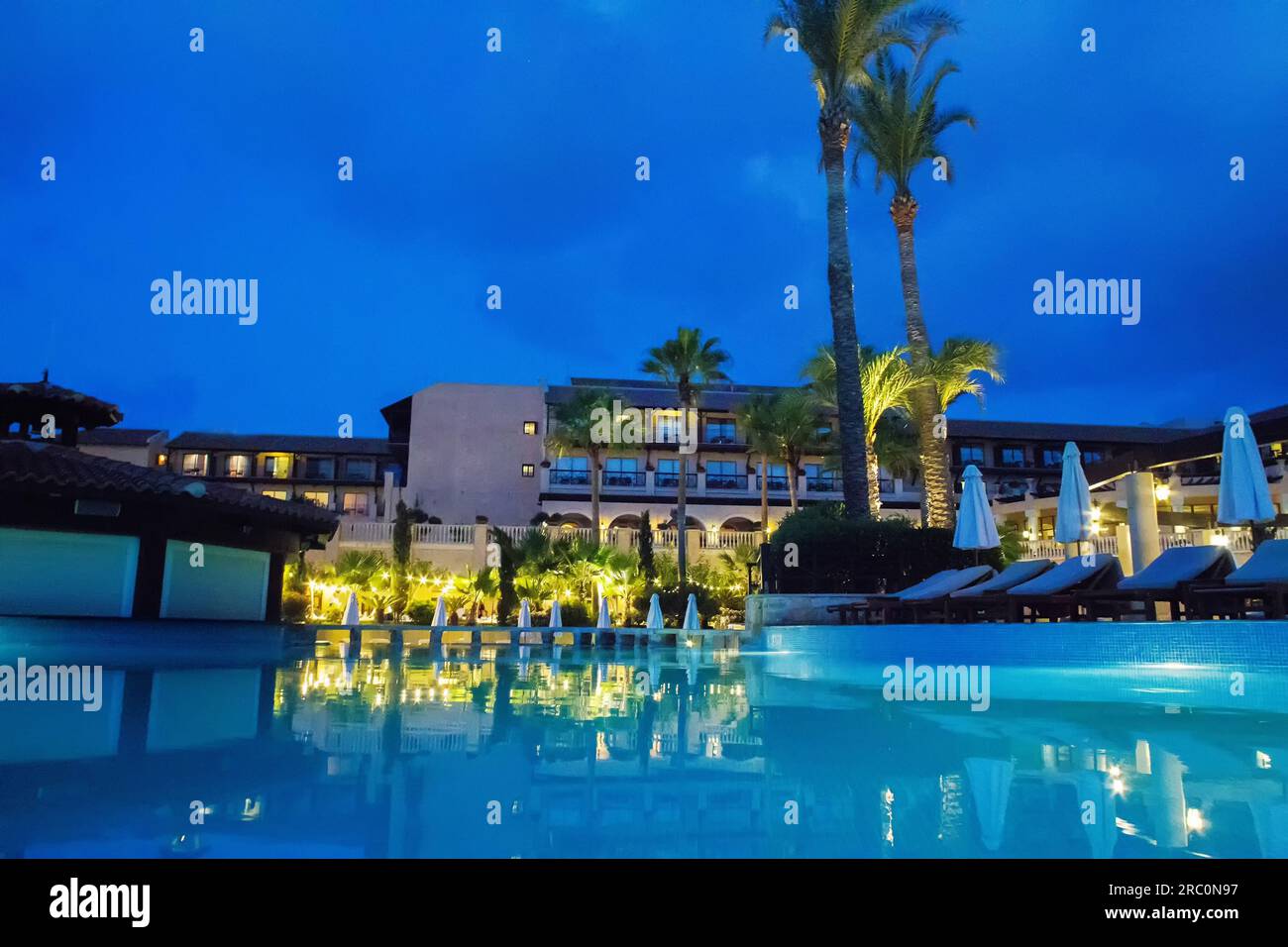 Fantastic night view on pool in twilights behind some pavilion ( bar ...