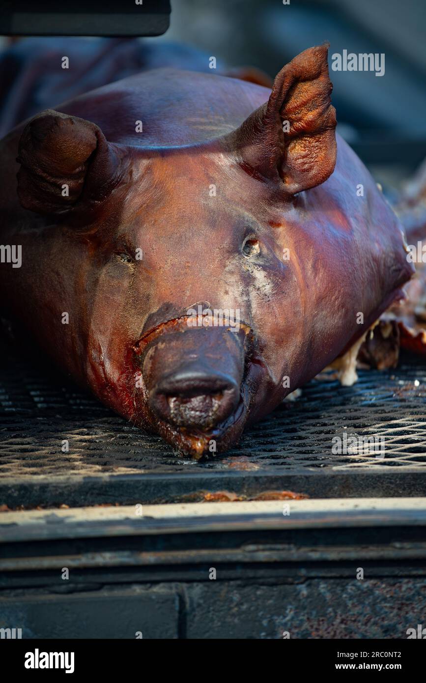 BBQ grill, roasting of whole pig. country fair Stock Photo - Alamy