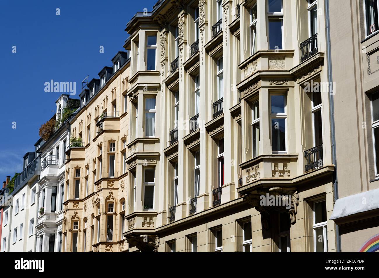 beautifully restored grunderzeit facades with bay windows in cologne's ...