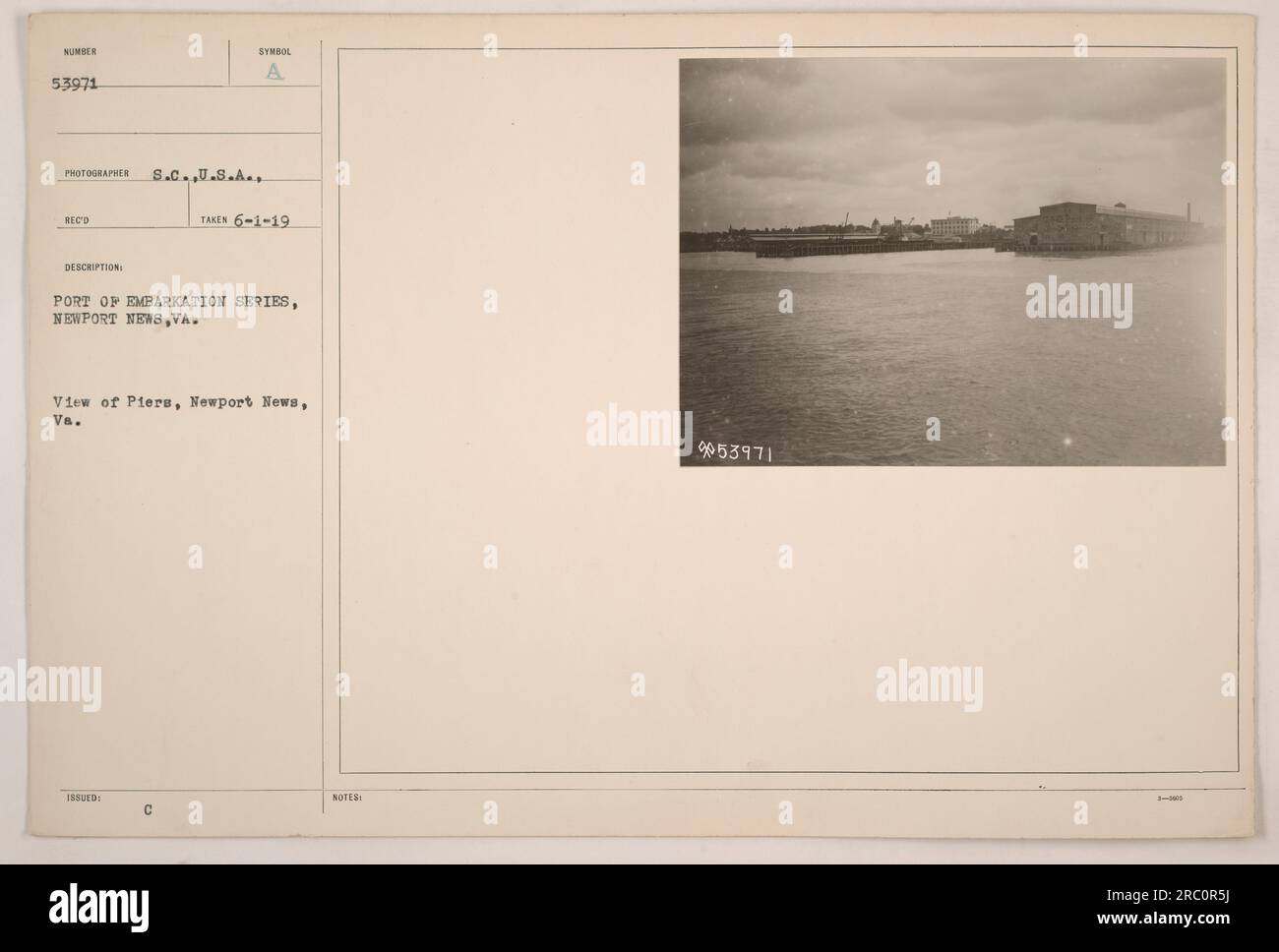 The photograph shows a view of the piers at Newport News, Virginia ...