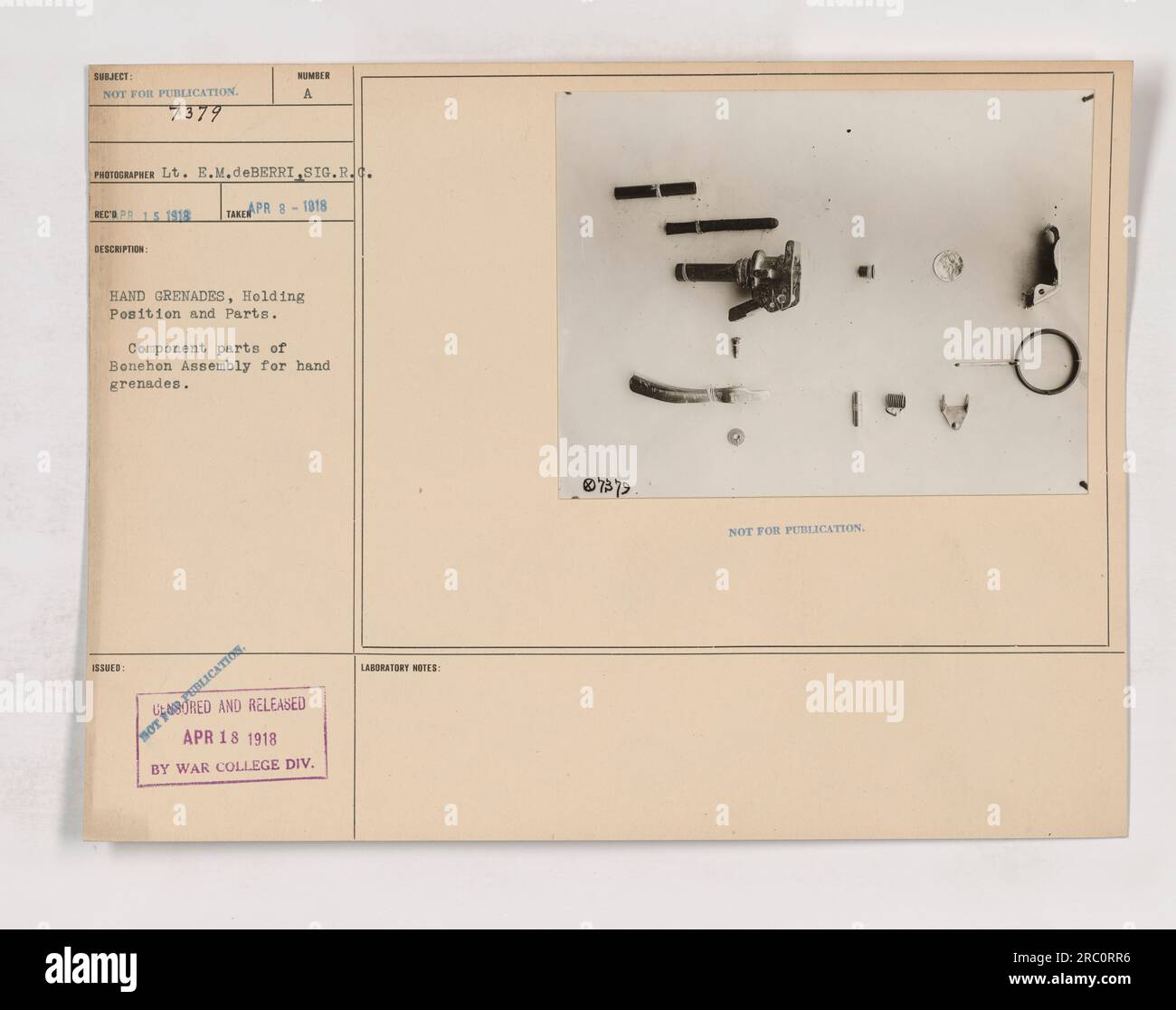 Image shows a hand grenade and its component parts laid out for ...
