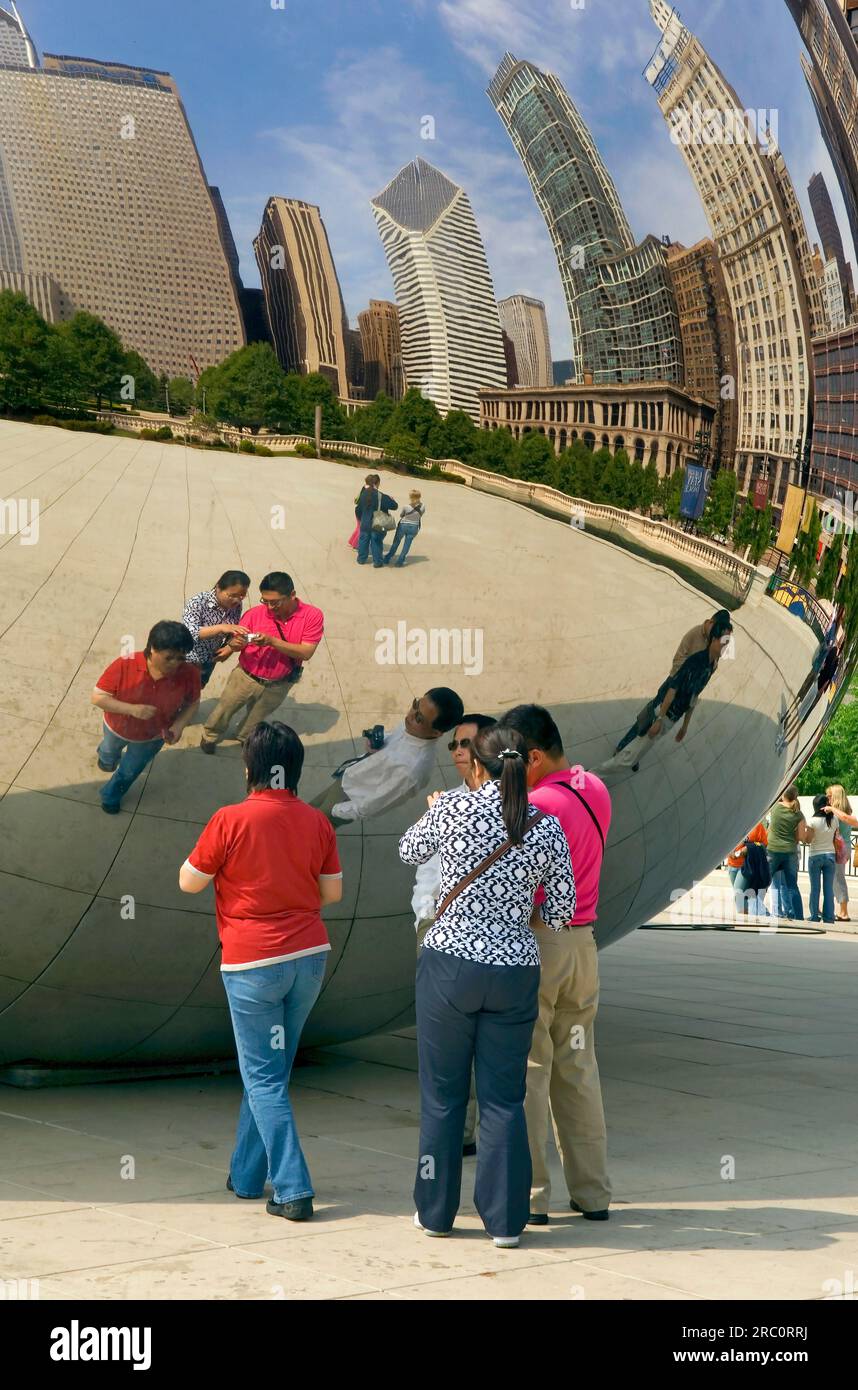Chicago skyline reflected in Cloud Gate sculpture in Millennium Park ...