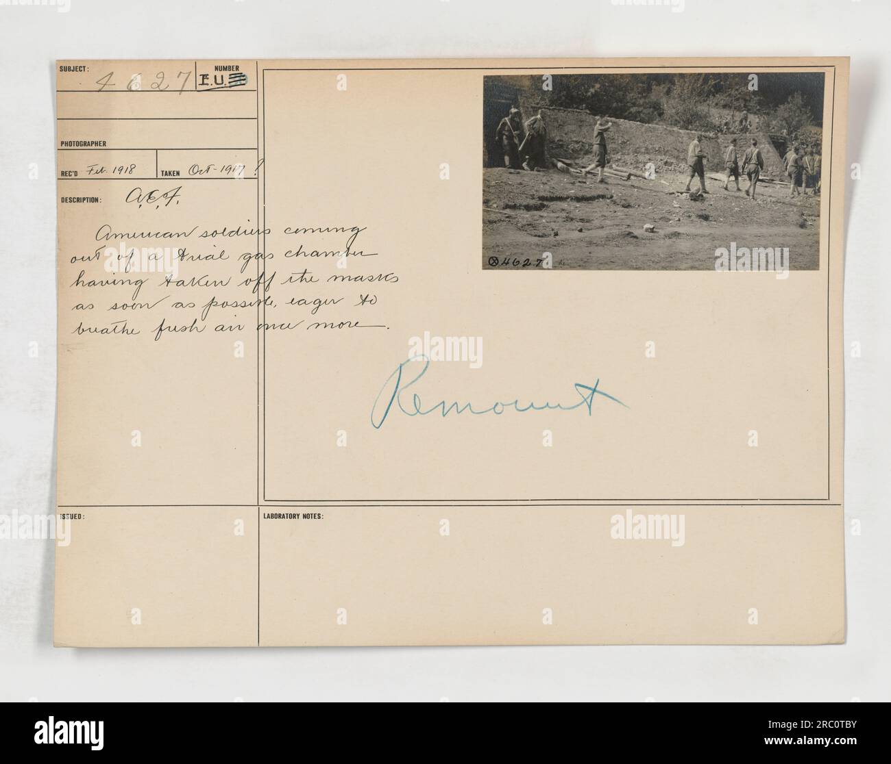 American soldiers emerging from a trial gas chamber, removing their ...