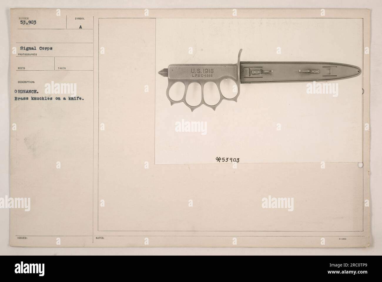 Close-up of a U.S. military-issued knife with brass knuckles attached ...