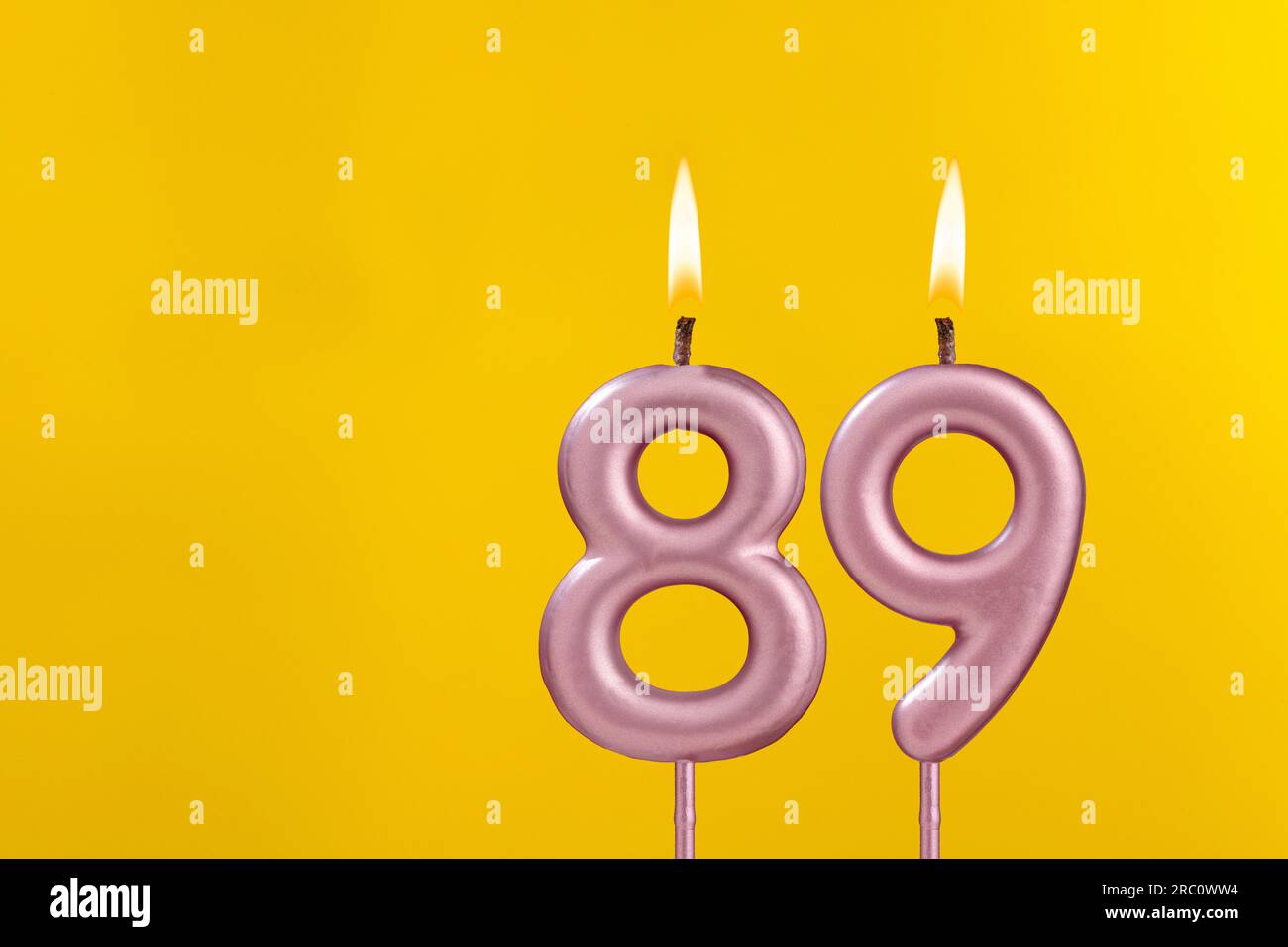 Birthday candle number 89 - Birthday celebration on yellow background ...